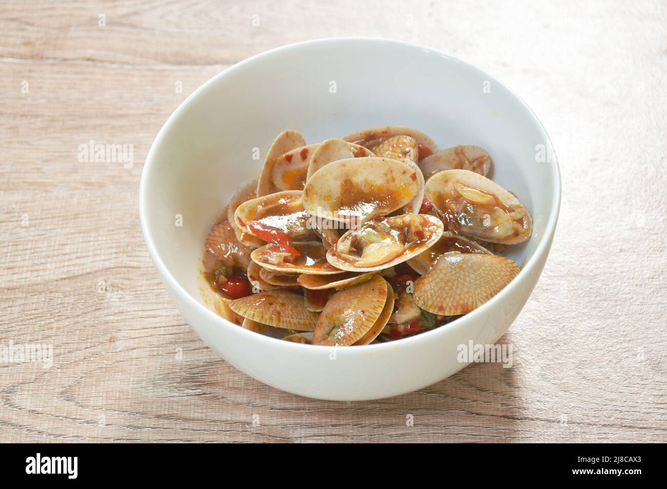 stir fried clams with roasted chili paste on bowl Stock Photo - Alamy