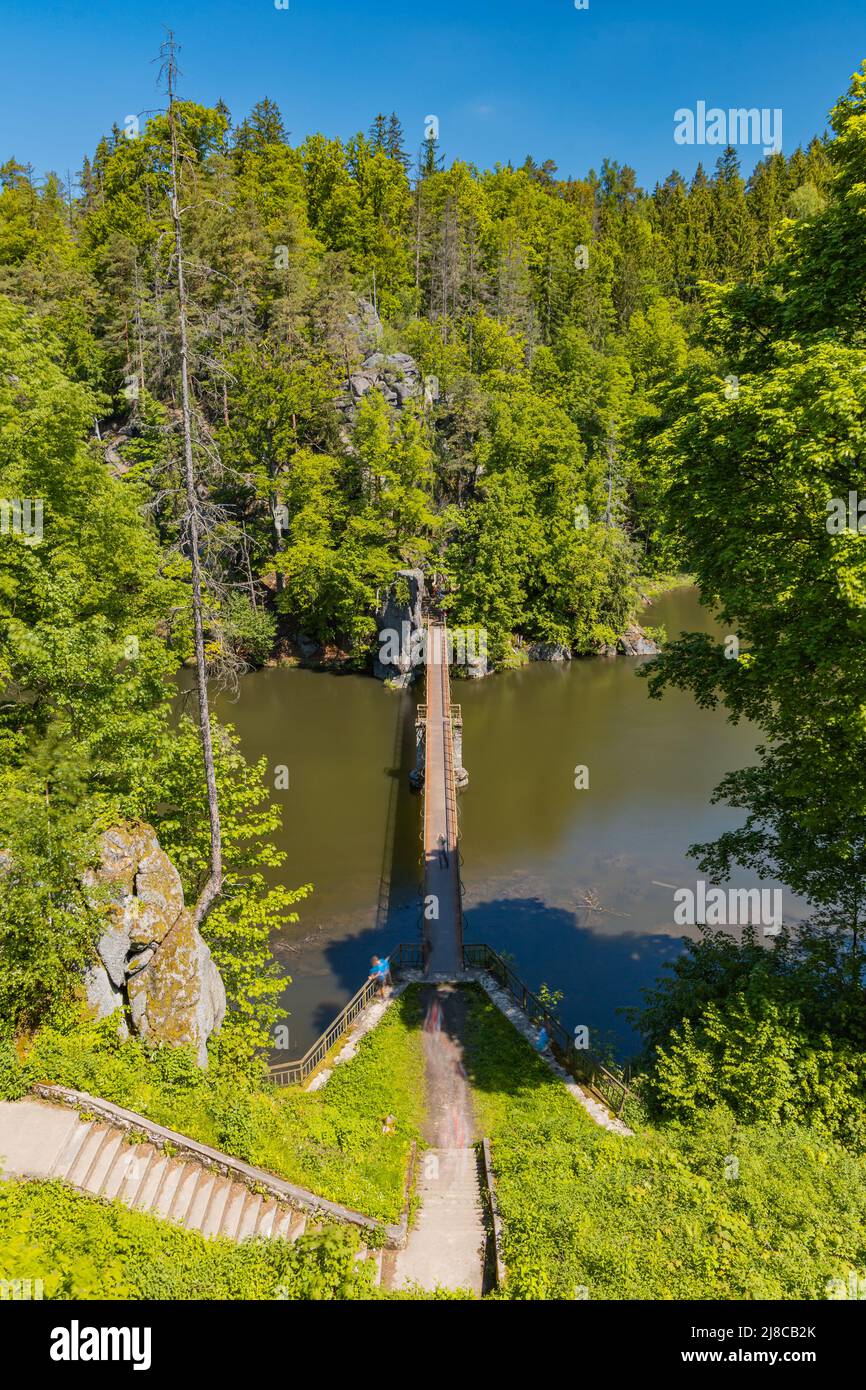Long steel hanging footbridge over Modre lake Stock Photo - Alamy