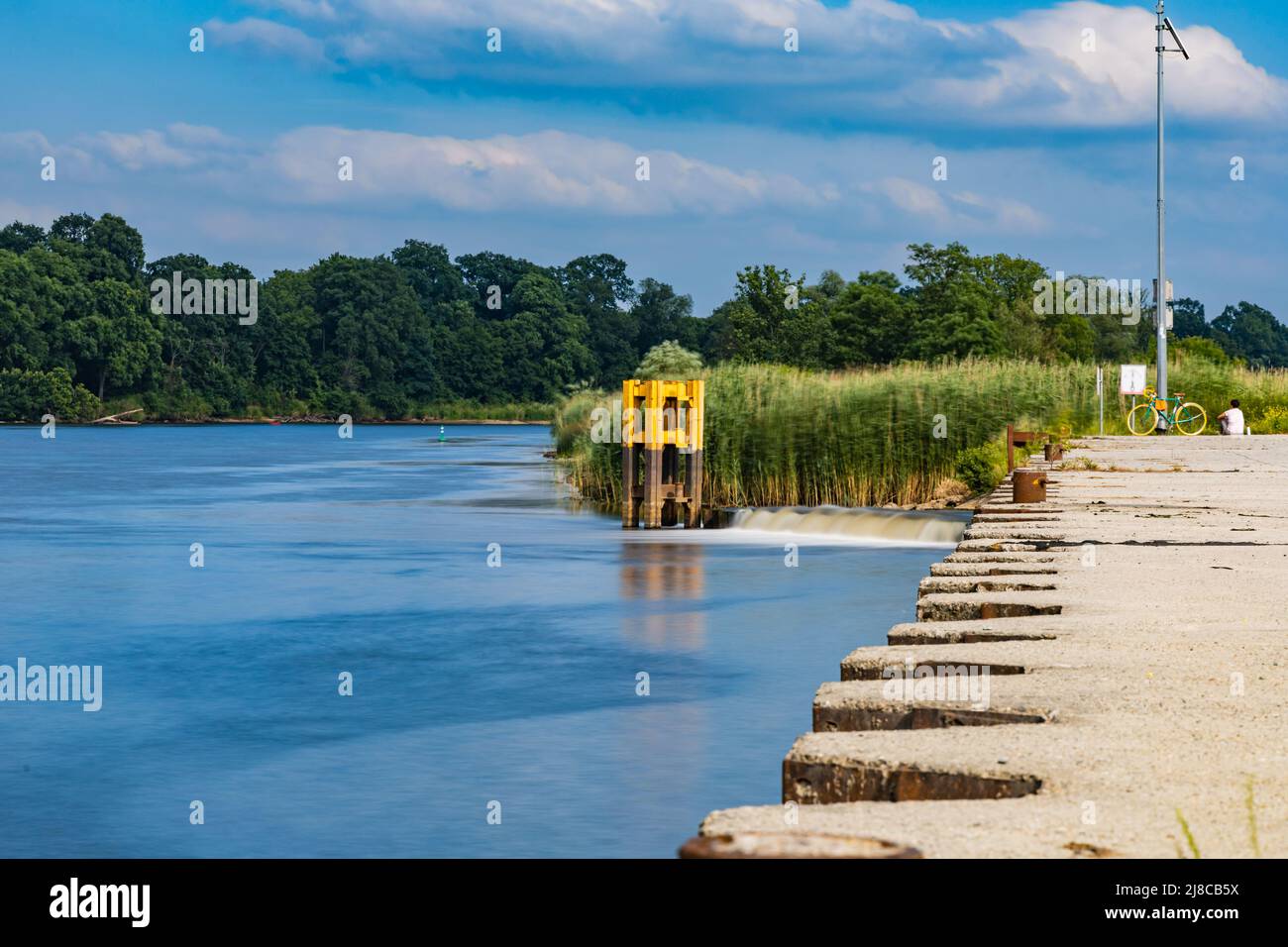 Silent river next to small wharf out of city center Stock Photo - Alamy