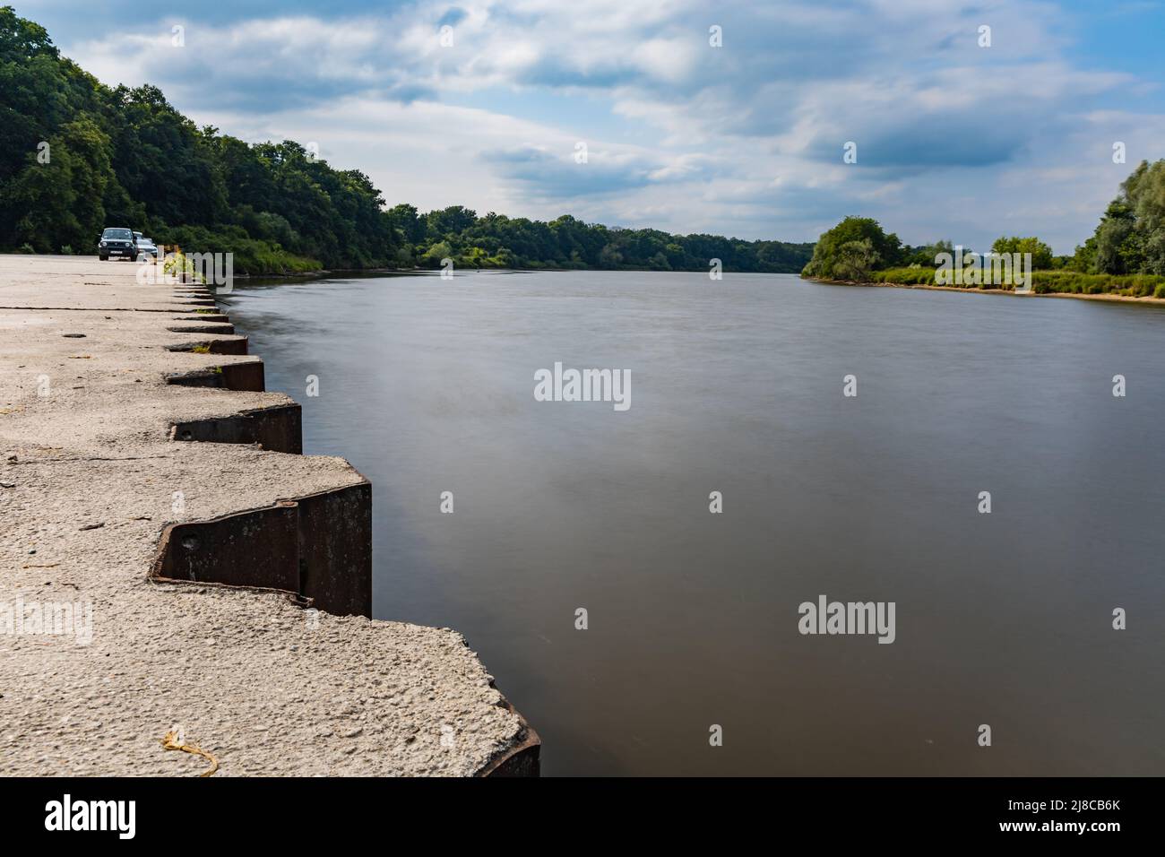 Silent river next to small wharf out of city center Stock Photo - Alamy