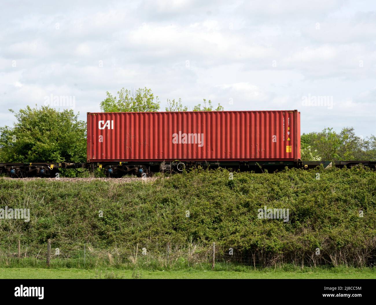 A CAI shipping container on a freightliner train, Warwickshire, UK ...