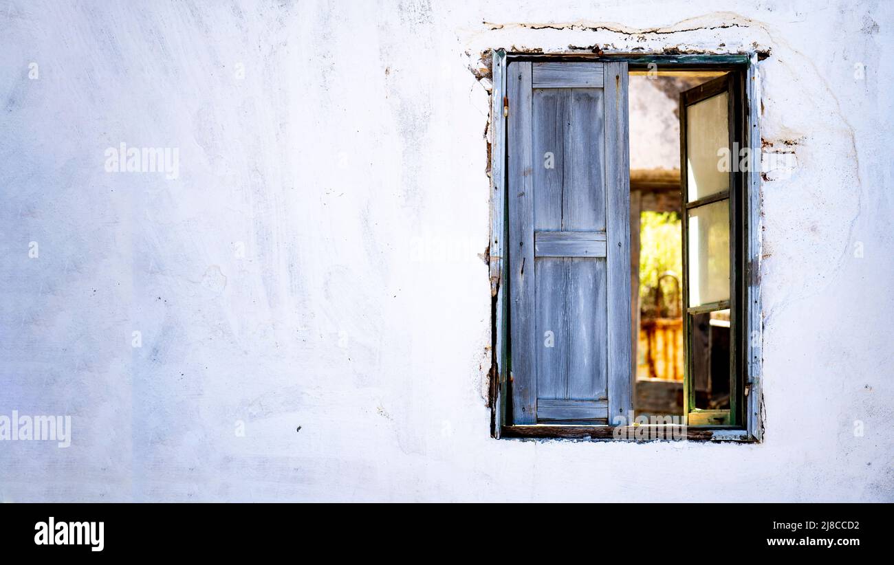 Banner of an Antique window on a white old wall and light from an ...