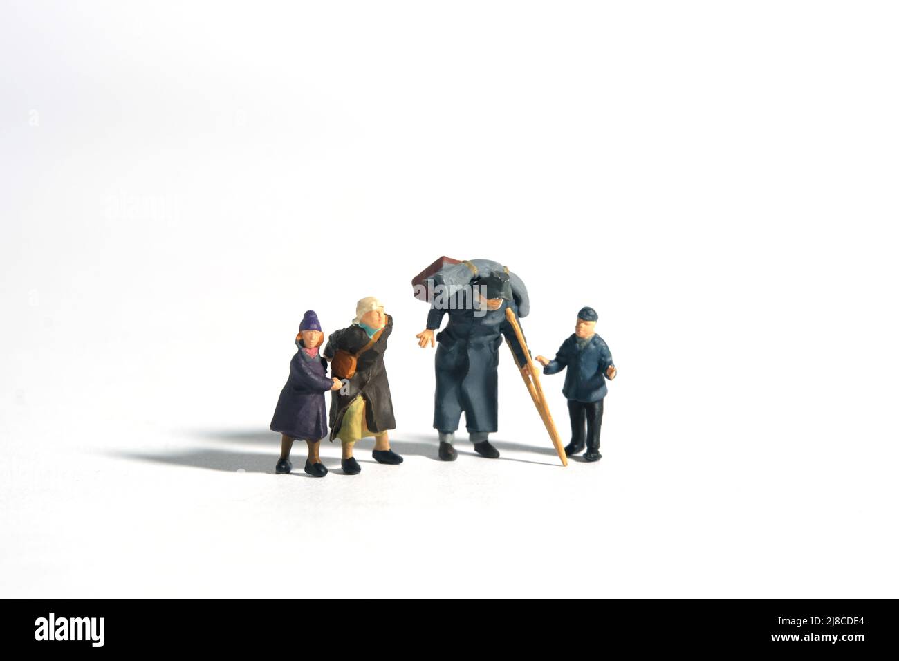 Miniature people toy figure photography. A group of poor family grandpa ...