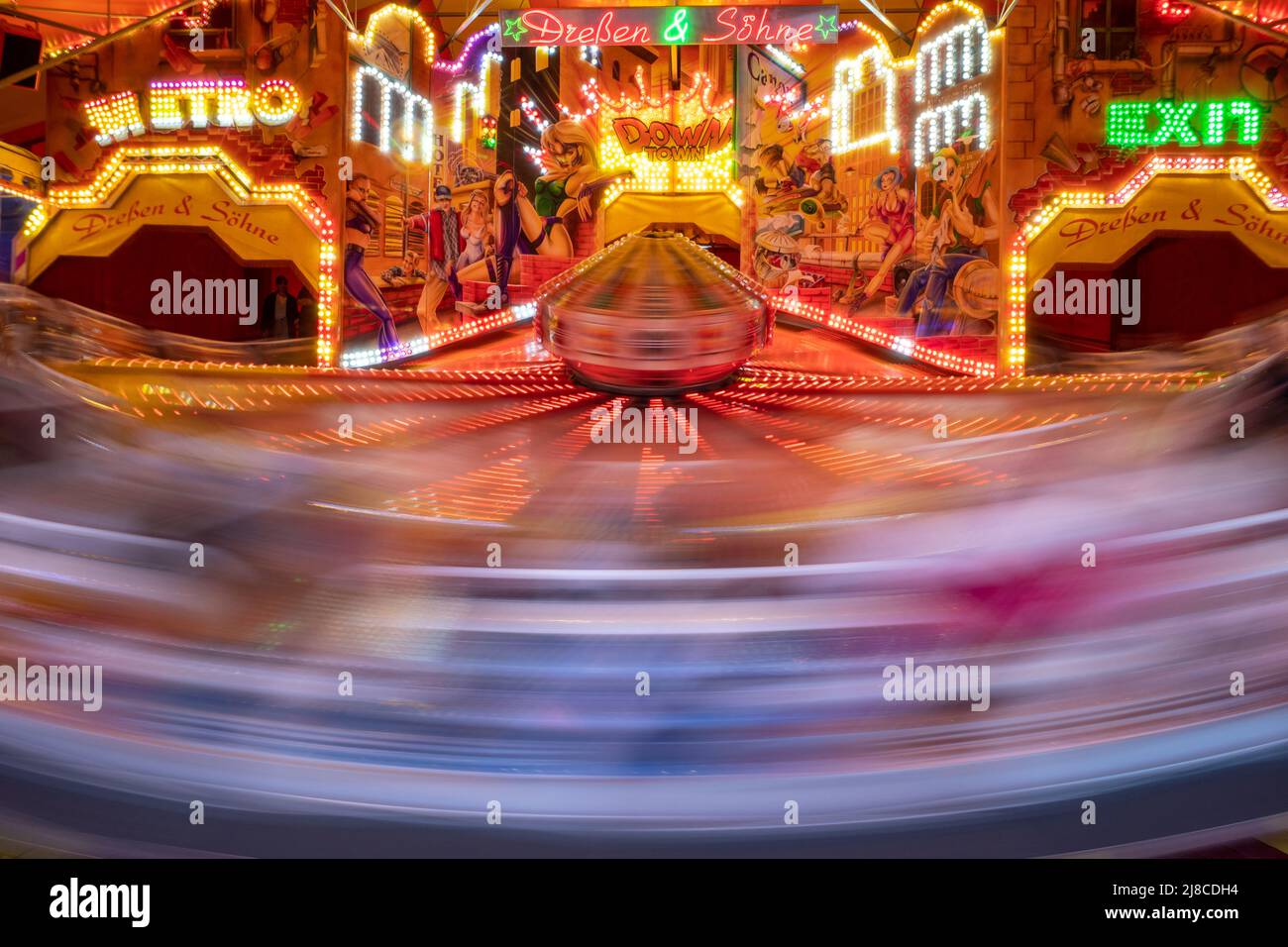 Selected focus and night scenery at illuminating amusement ride of ...