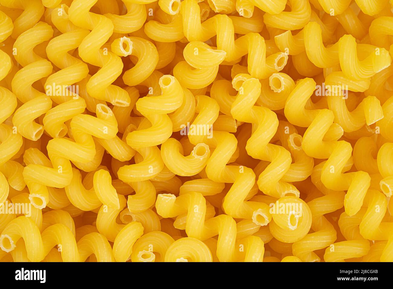 Italian pasta cavatappi background. Top view Stock Photo - Alamy