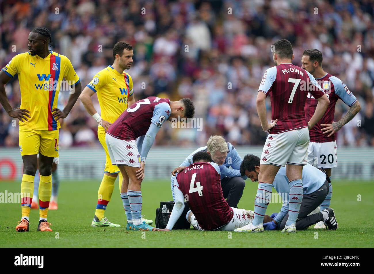 Aston Villa's Ezri Konsa receives treatment before going off with an ...