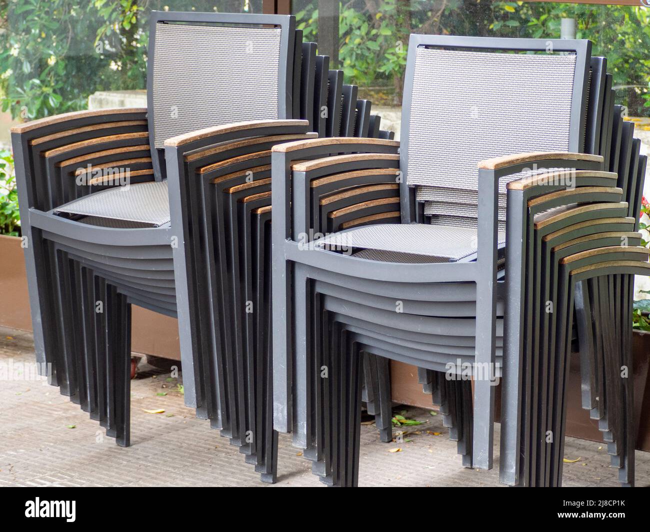 Empty chairs and tables at closed outdoor restaurant for the inflation ...