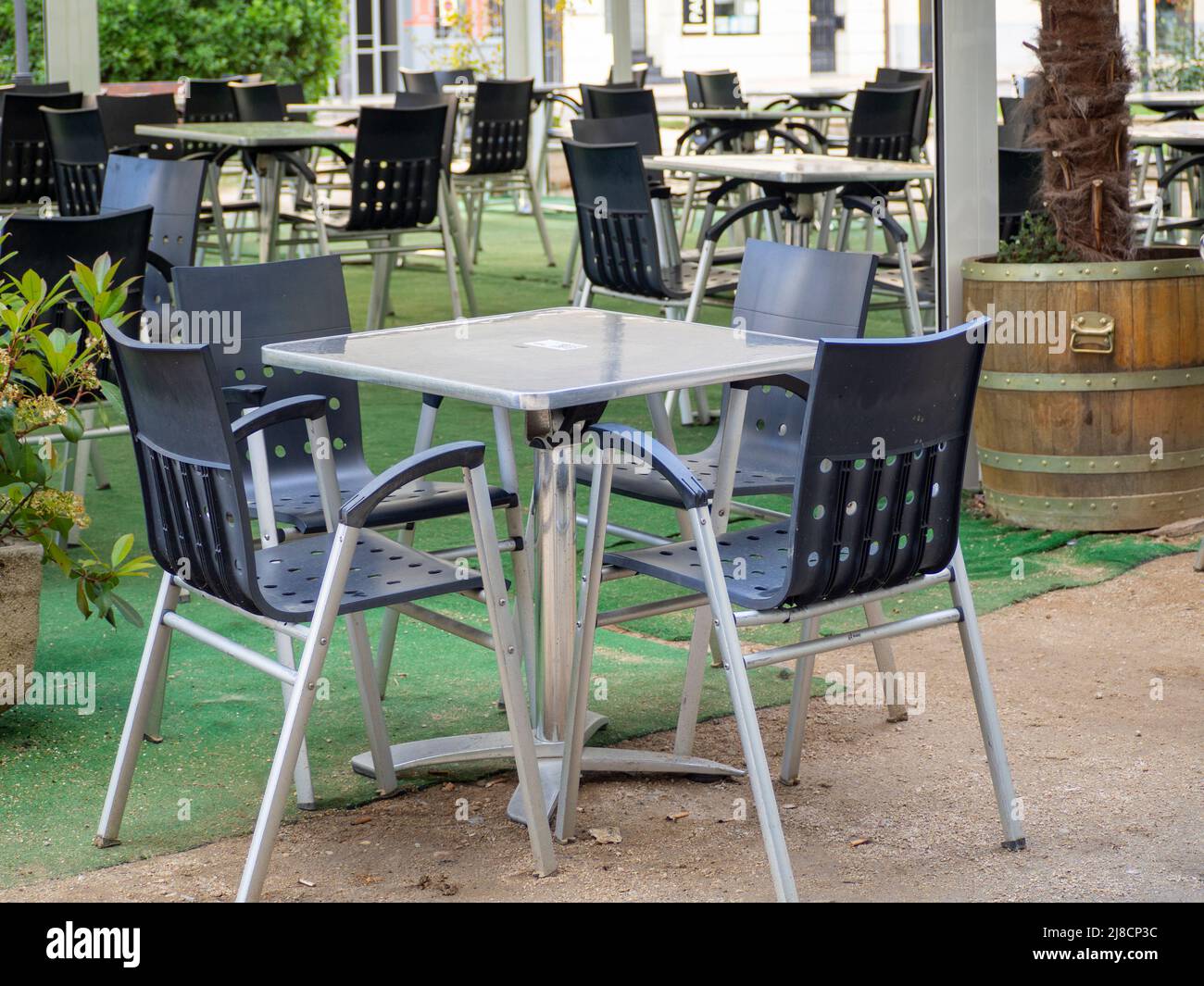 Empty chairs and tables at closed outdoor restaurant for the inflation ...