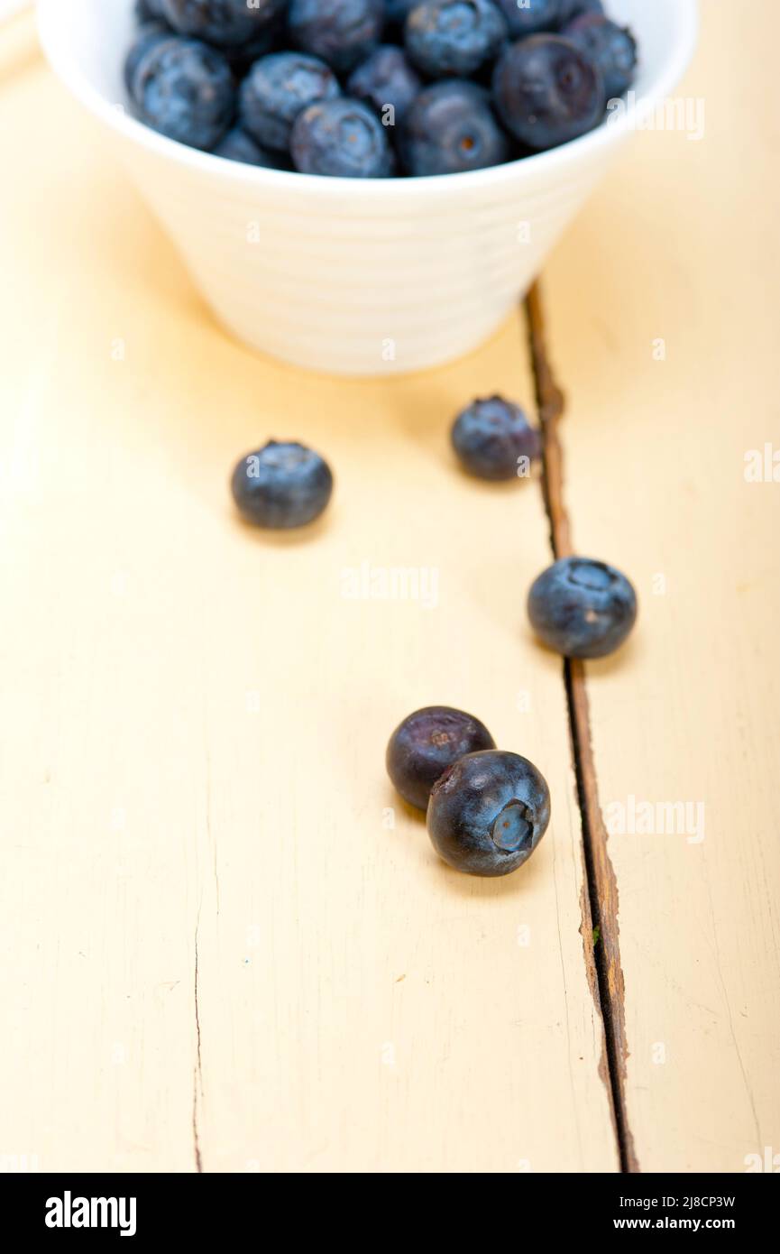 fresh blueberry on a bowl with silver spoon over wood table Stock Photo ...