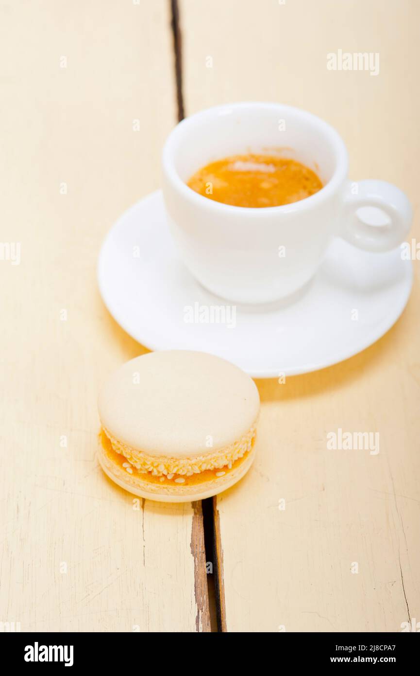 colorful macaroons with espresso coffee over white wood table Stock ...