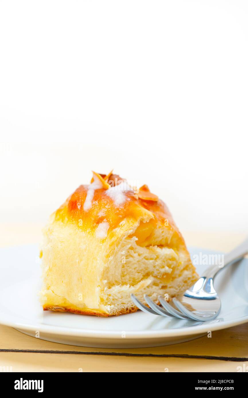 fresh home baked sweet bread donut cake with almonds and icing sugar on ...