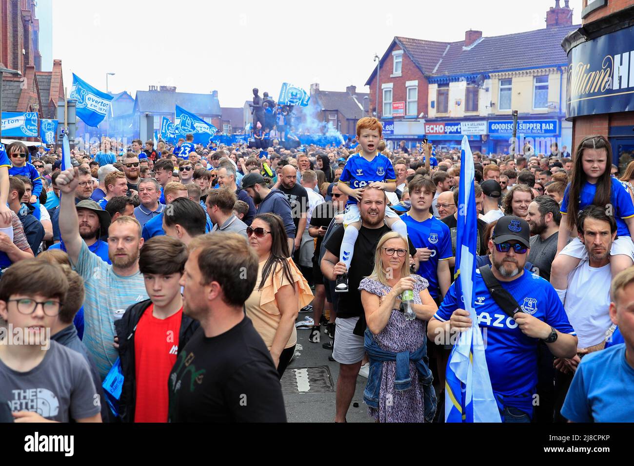 Everton fans await the arrival of the team bus Stock Photo - Alamy