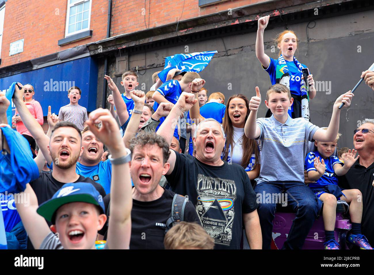 Everton fans await the arrival of the team bus Stock Photo - Alamy