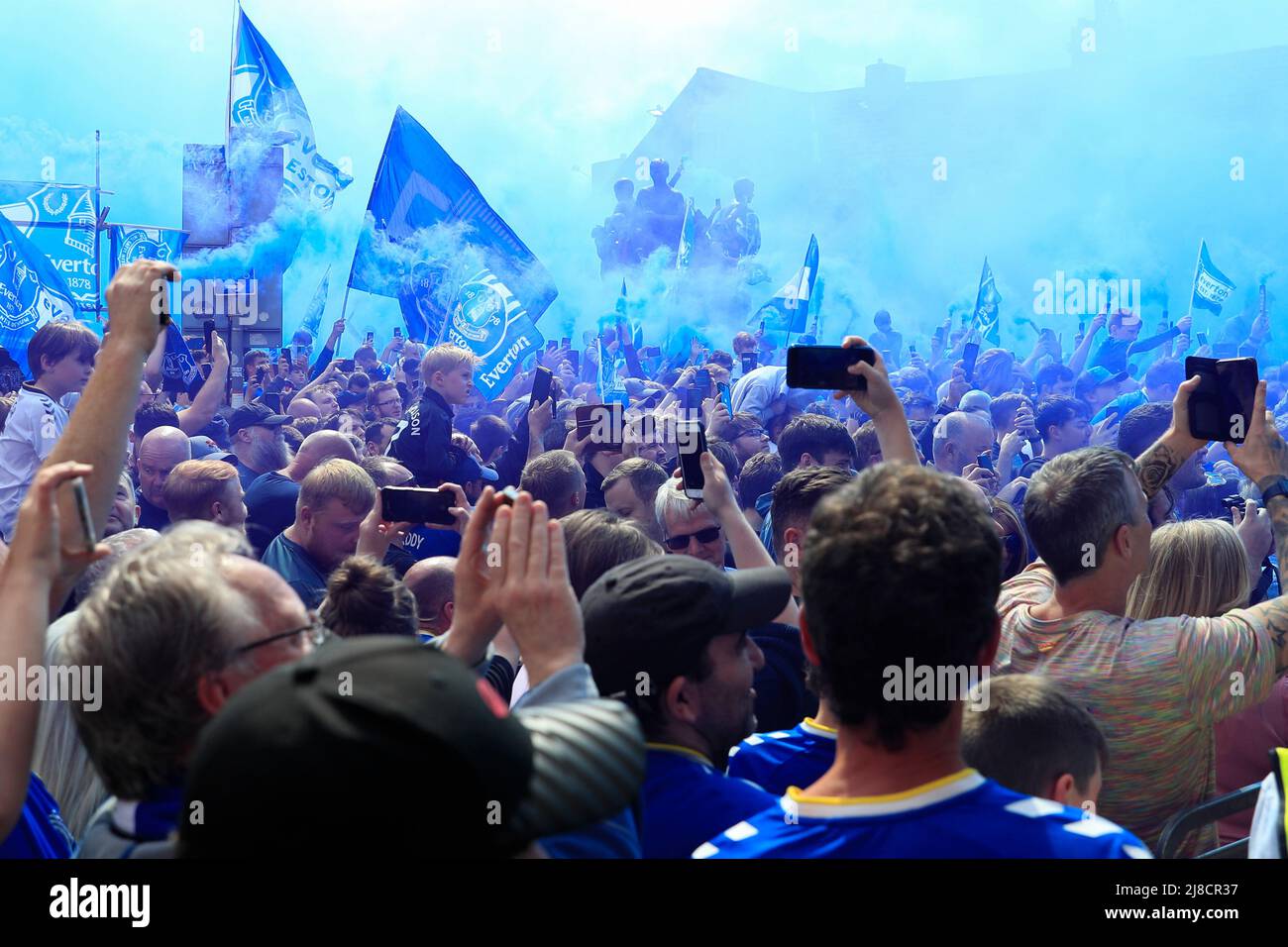 Everton fans await the arrival of the team bus Stock Photo - Alamy