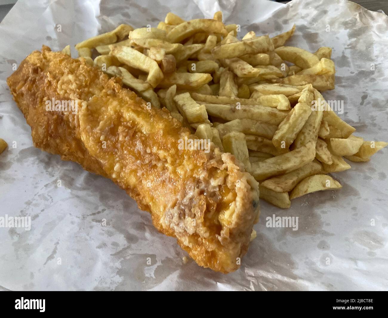 Traditional British Fish and Chips in paper Stock Photo - Alamy