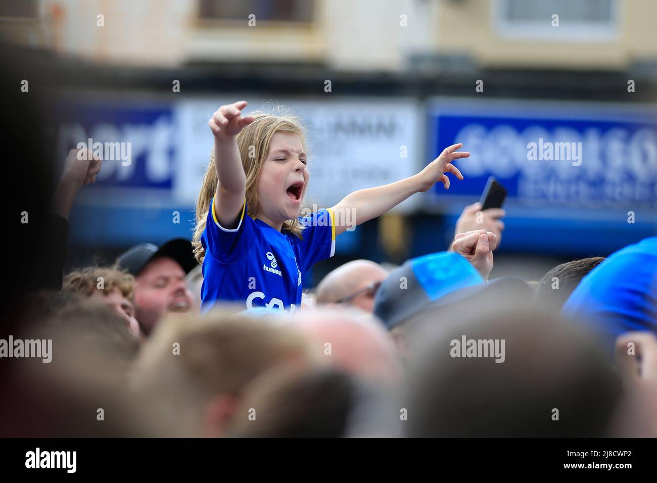 Everton fans await the arrival of the team bus Stock Photo - Alamy