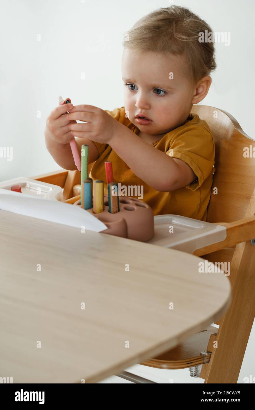 Kids having fun at home by the table, creating hand made art. Children ...