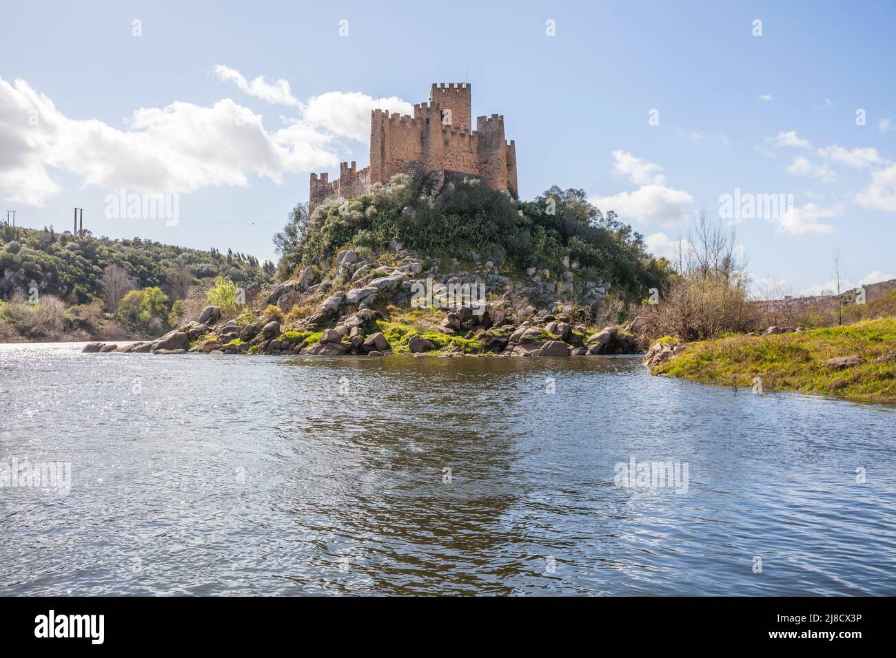 View from the banks of the Tajo River towards Almourol Castle, situated ...