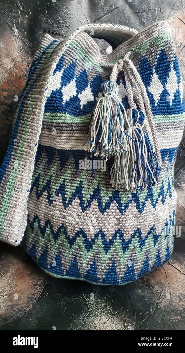 Handmade bags. Knitted from colored threads. Volumetric and comfortable ...