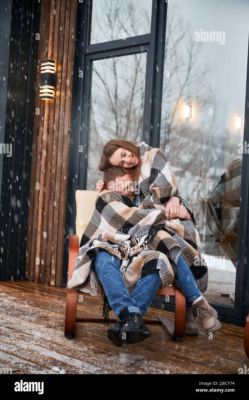 Couple Cuddling In Blankets