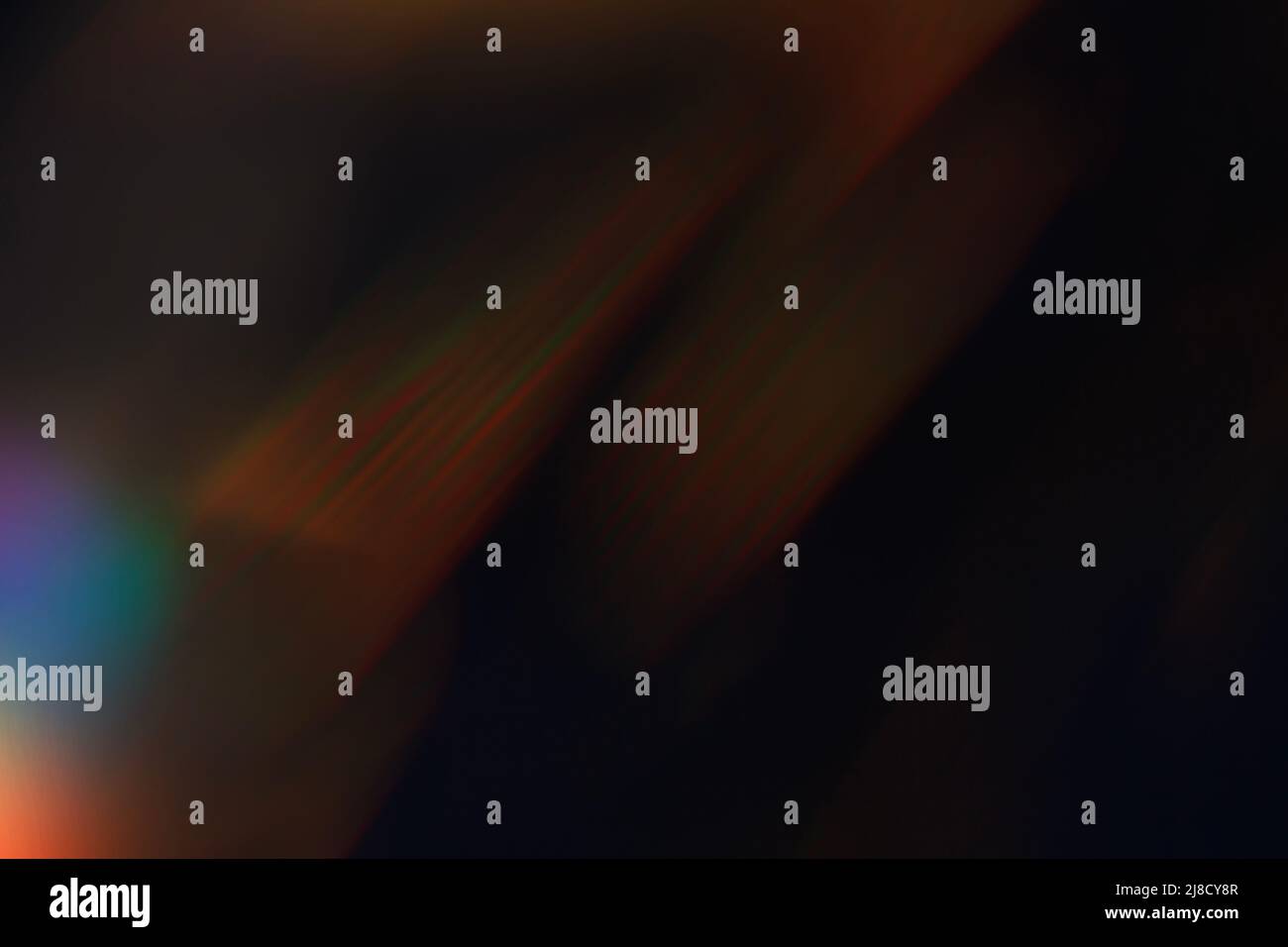 Colorful light leak on black background, abstract design with optical ...
