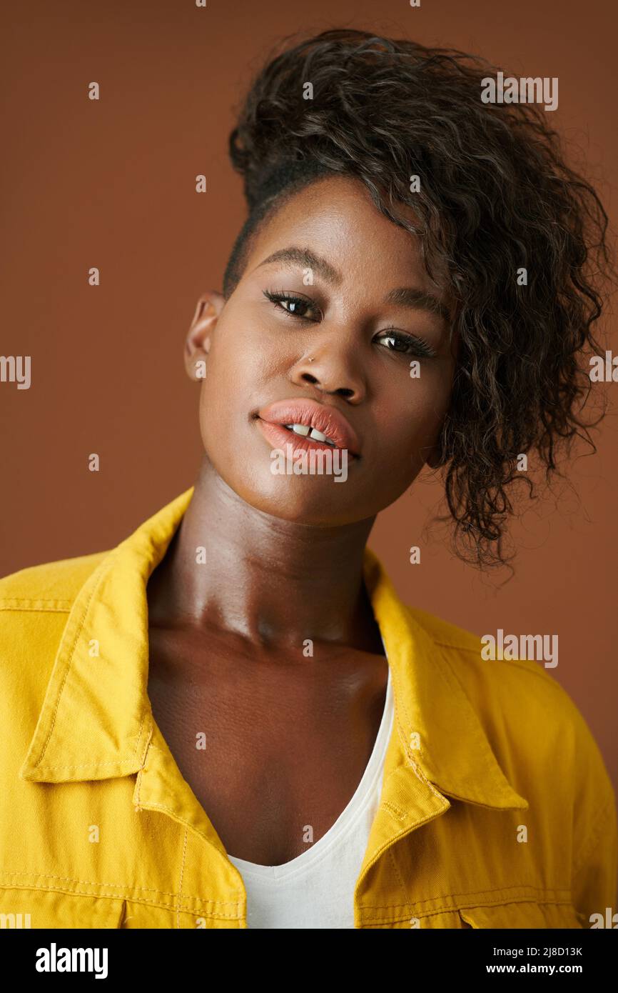 Face Of Pretty Young Black Woman With Curly Hair And Full Lips Looking