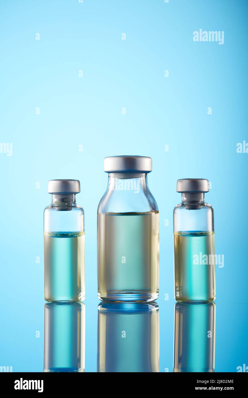 Vaccine injectable vials and syringe close up in blue tones Stock Photo ...