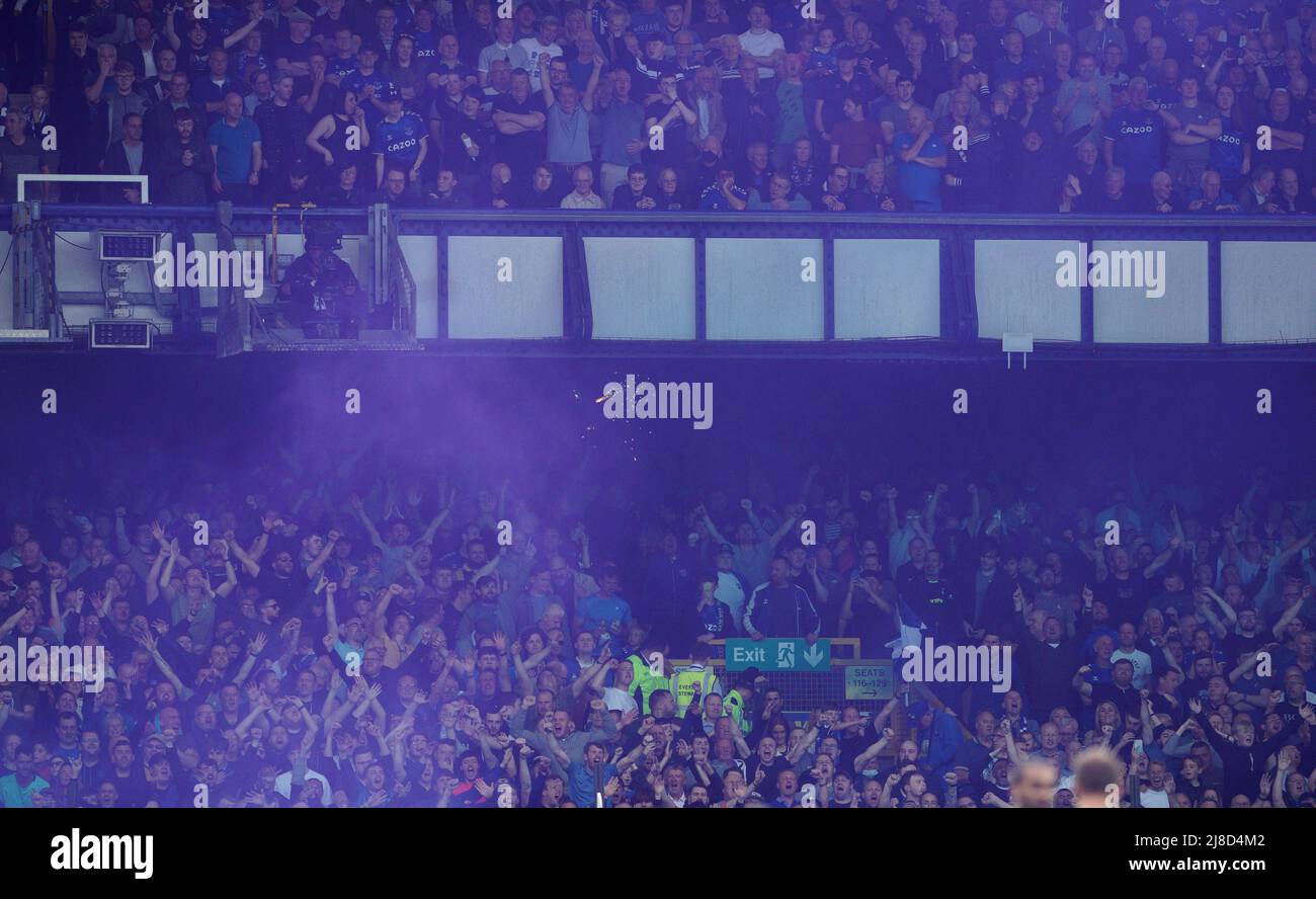A flare is set off in the stands as Everton fans celebrate their team ...