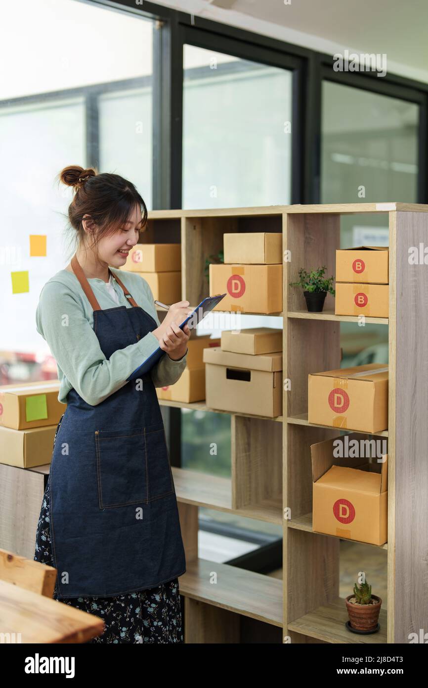 A portrait of a small startup, an SME owner, an Asian female ...