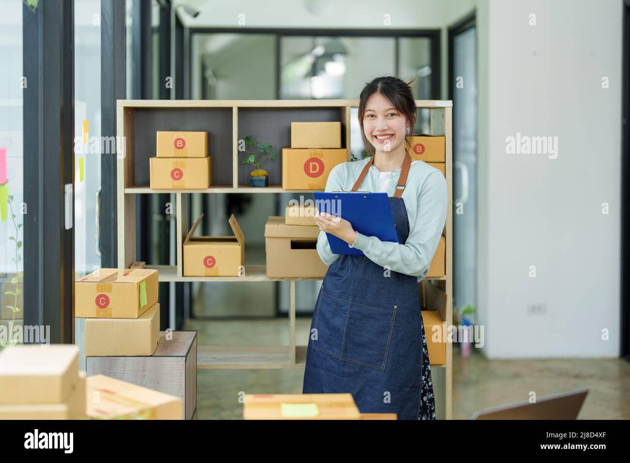 A portrait of a small startup, an SME owner, an Asian female ...