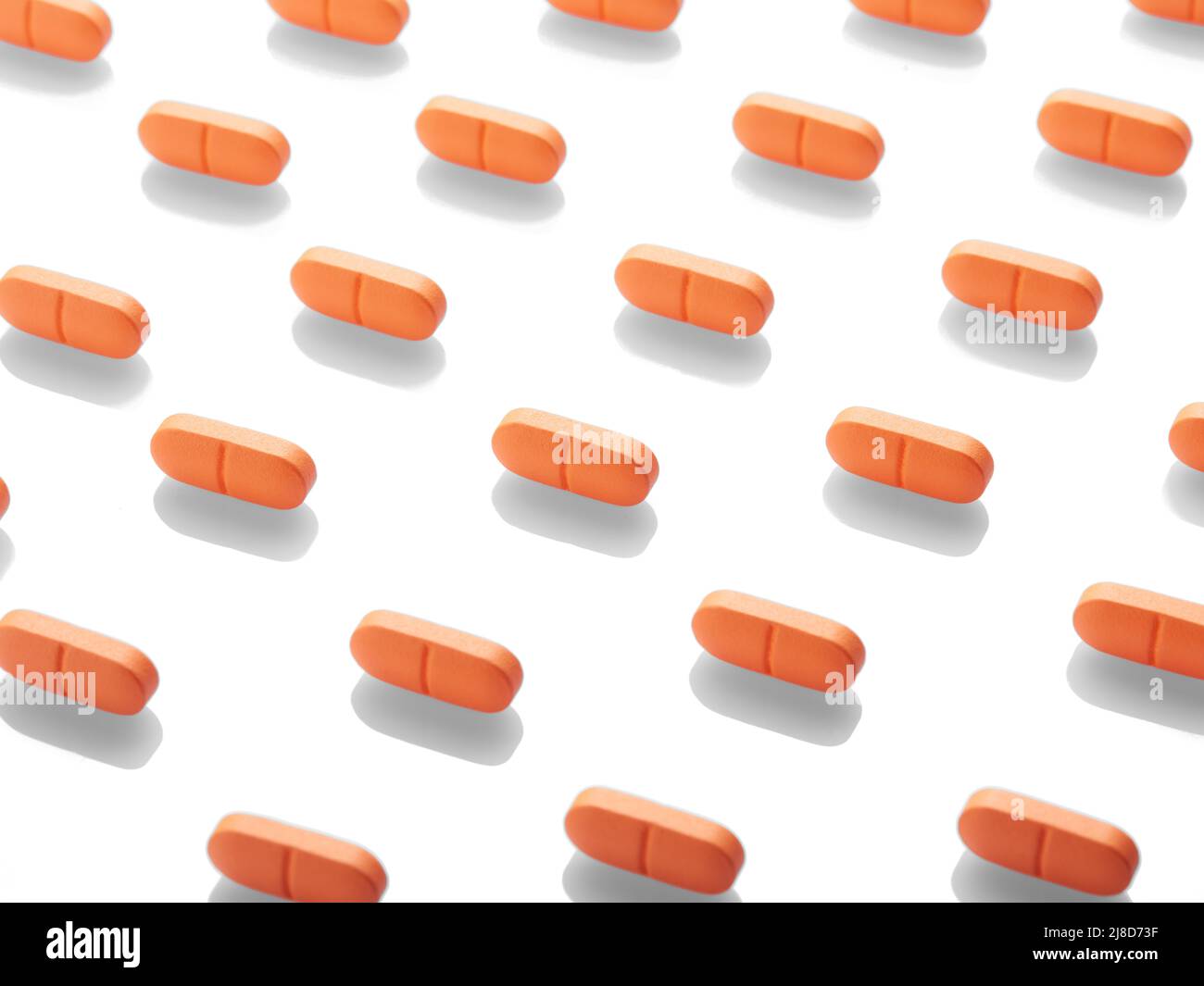 Pills in a row on white background. Horizontal composition Stock Photo ...