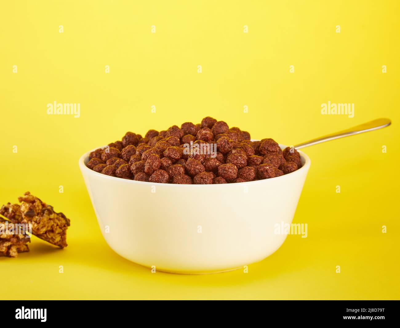 Chocolate Corn balls in bowl over yellow background Stock Photo - Alamy