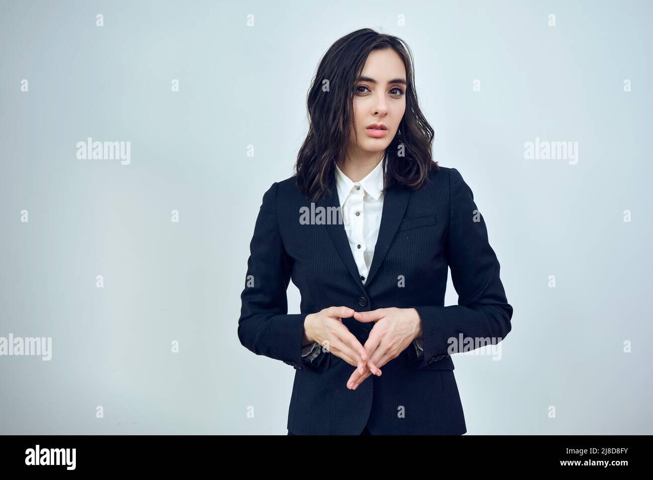 portrait of a beautiful young adult businesswoman manager wearing black ...
