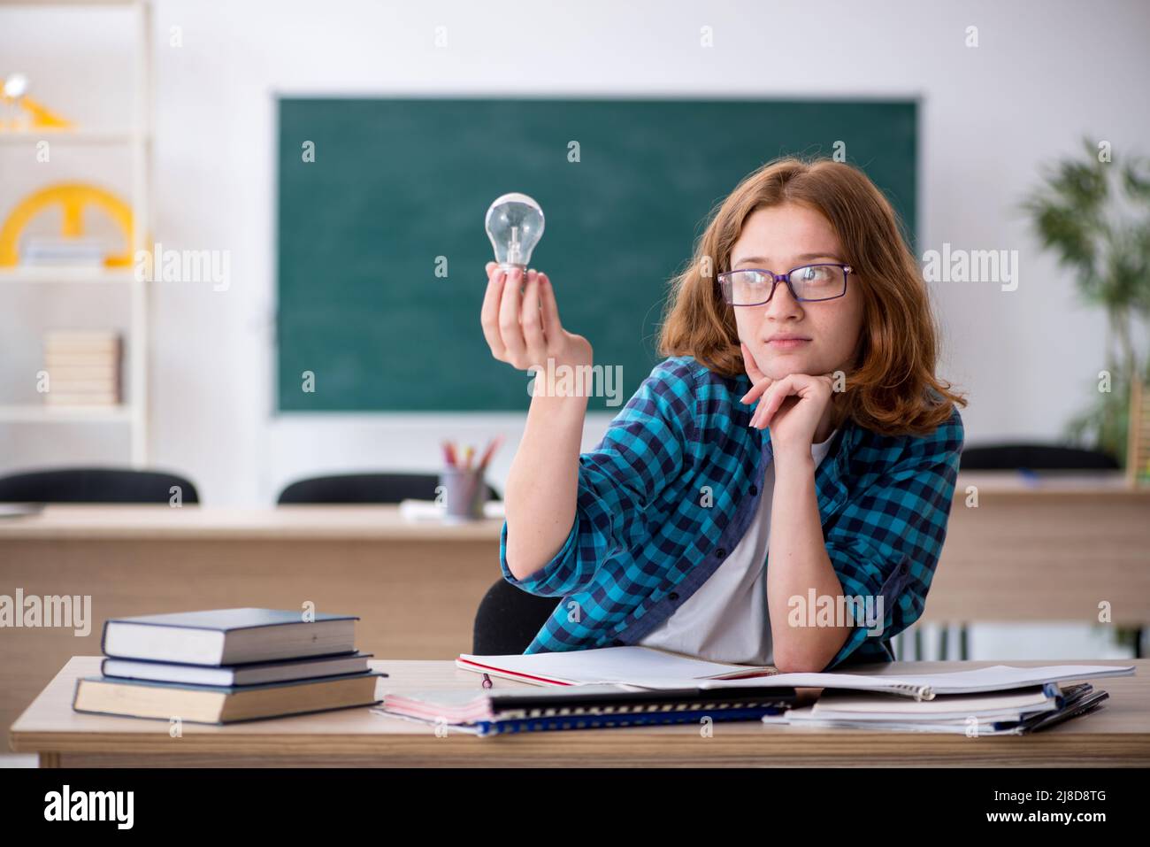 Female student in happy idea concept Stock Photo - Alamy