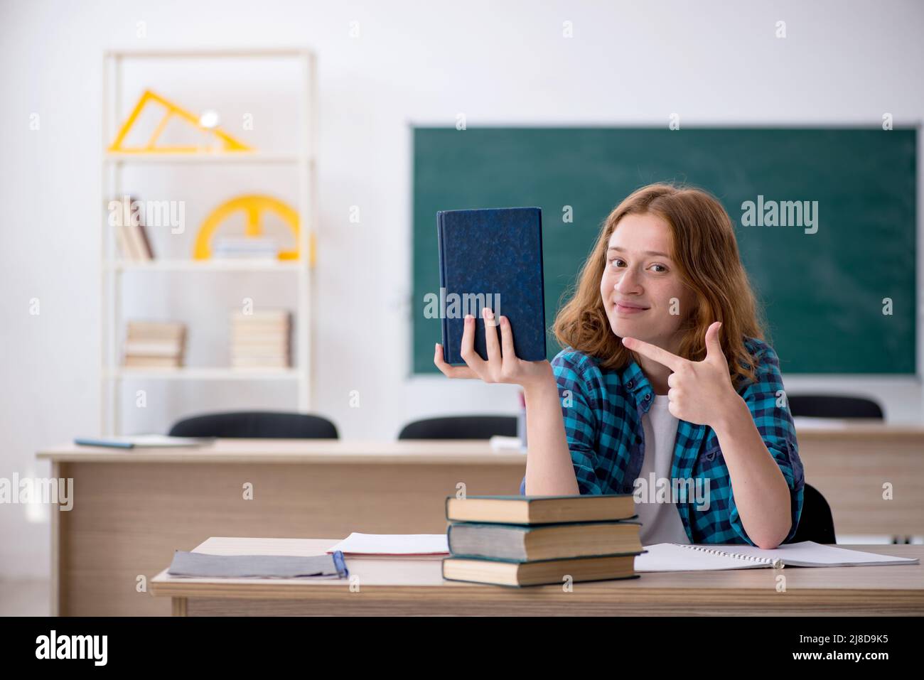 Female student preparing for exams in the classroom Stock Photo - Alamy