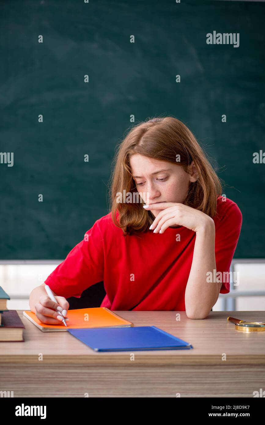 Female student preparing for exams in the classroom Stock Photo - Alamy