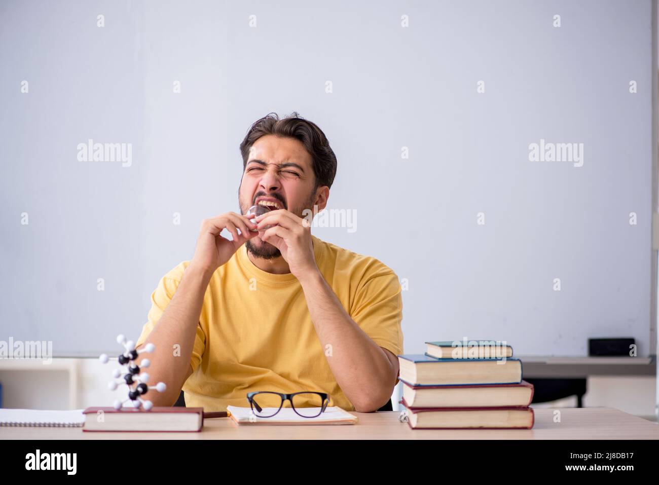 Young student in happy idea concept in the classroom Stock Photo - Alamy