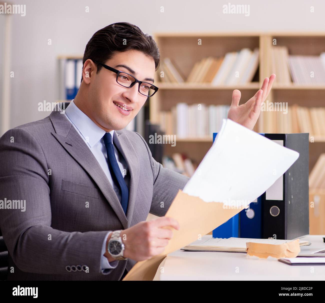The businessman receiving letter in the office Stock Photo - Alamy
