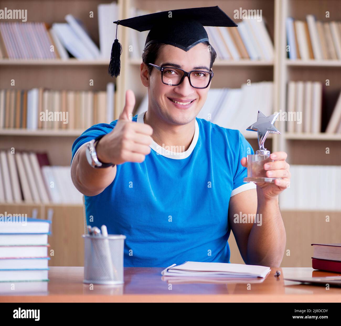 The young man graduating from university Stock Photo - Alamy