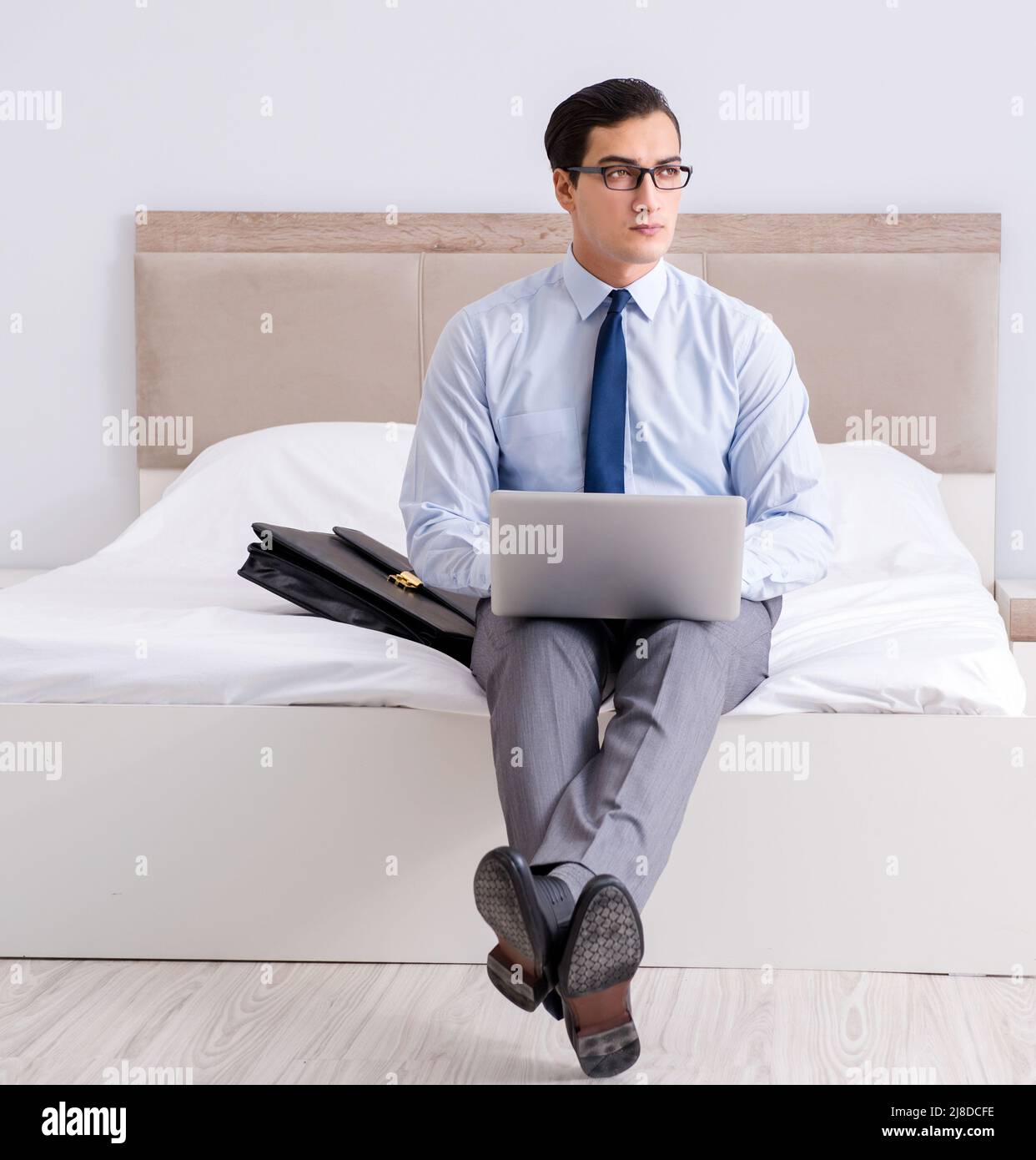 The businessman working in hotel room Stock Photo - Alamy