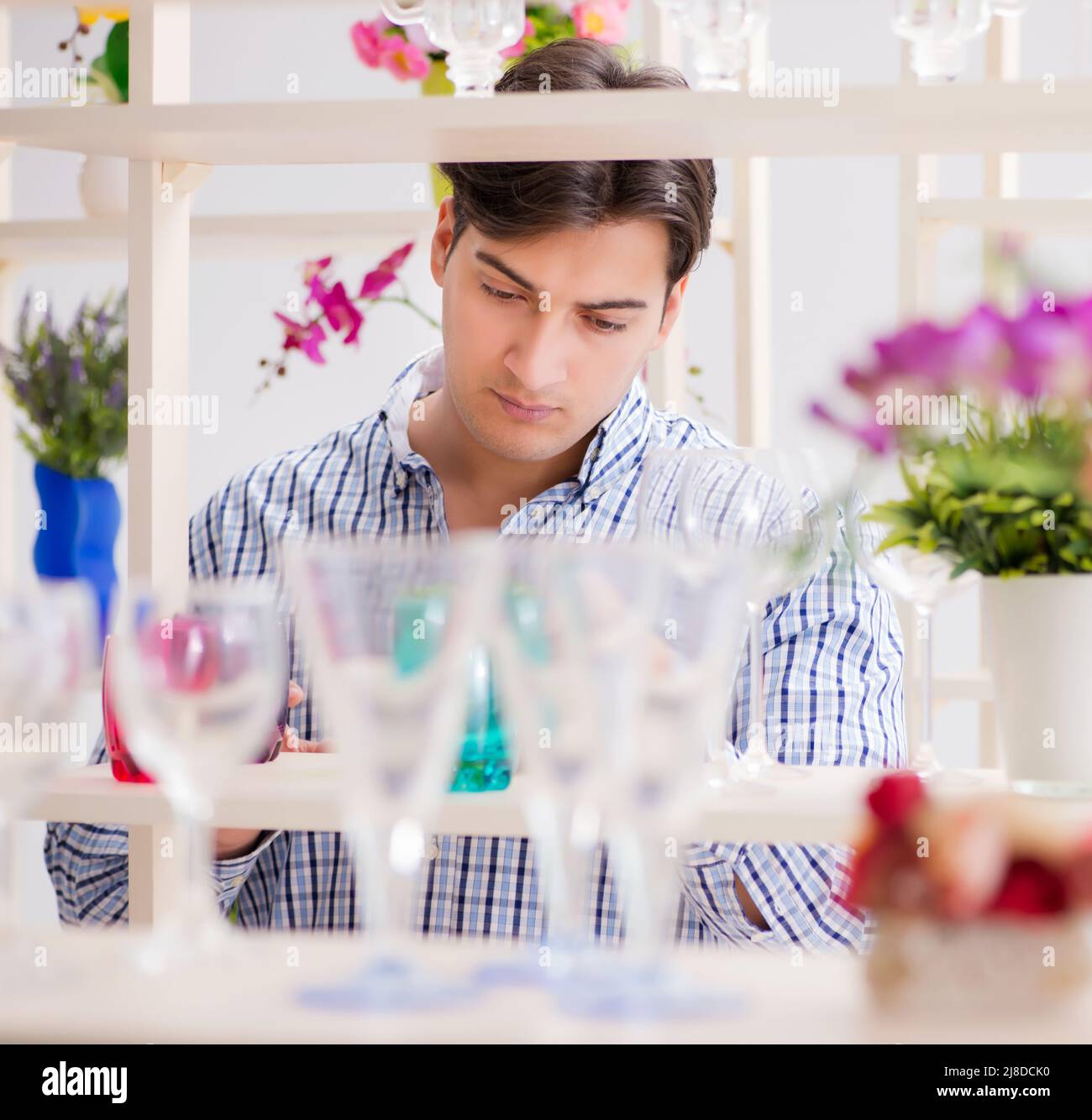 The young handsome man shopping in shop Stock Photo - Alamy