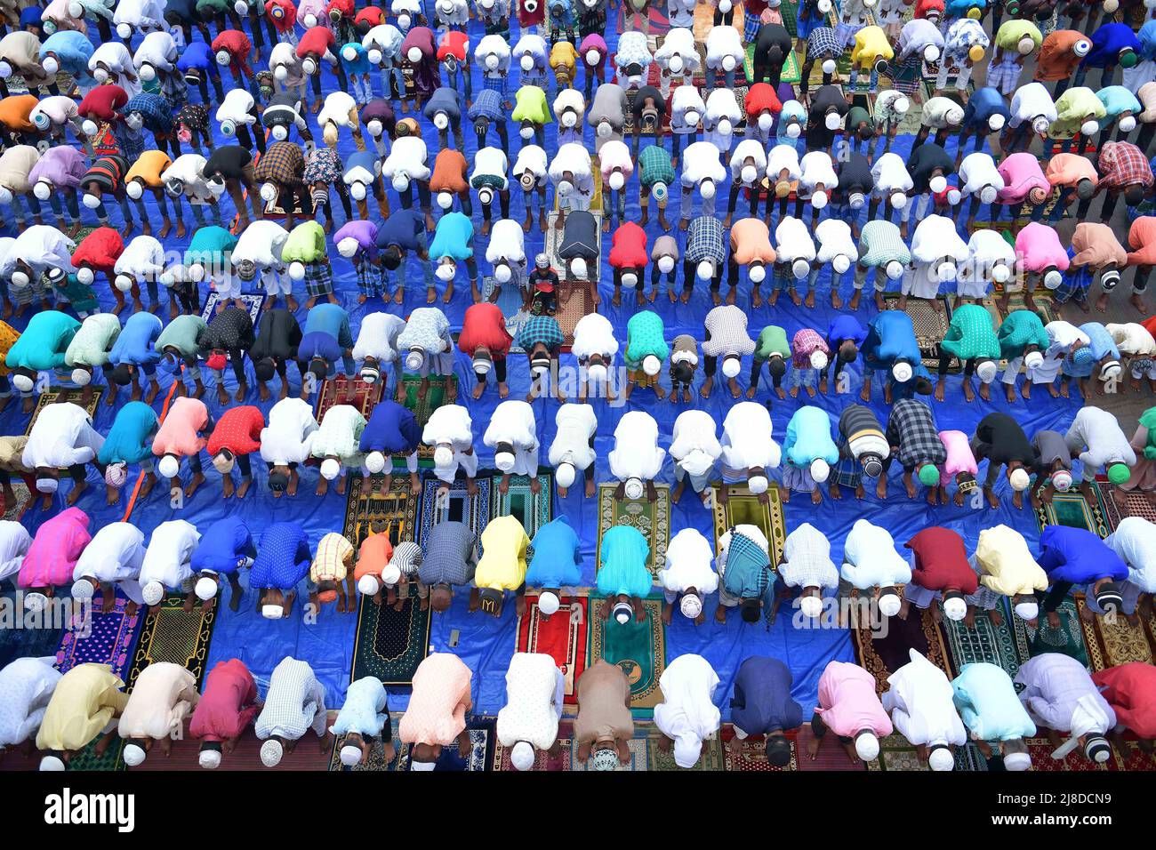 Muslim devotees offer a special prayer on Eid-Al-Fitr festival, which ...