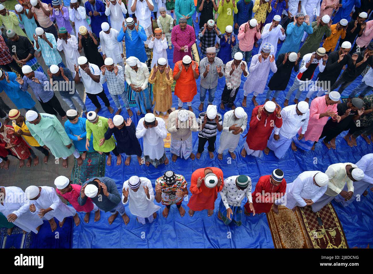 Muslim devotees offer a special prayer on Eid-Al-Fitr festival, which ...
