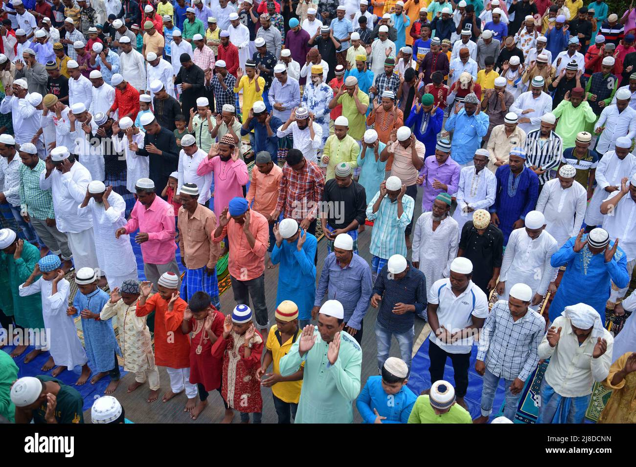 Muslim devotees offer a special prayer on Eid-Al-Fitr festival, which ...