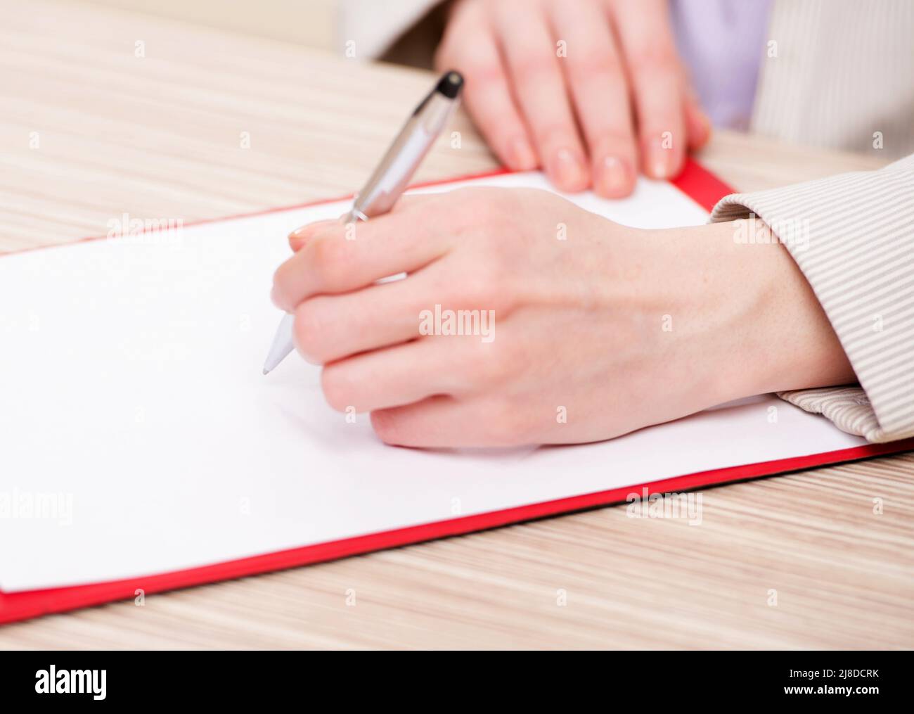 The hands taking notes in the pad Stock Photo - Alamy