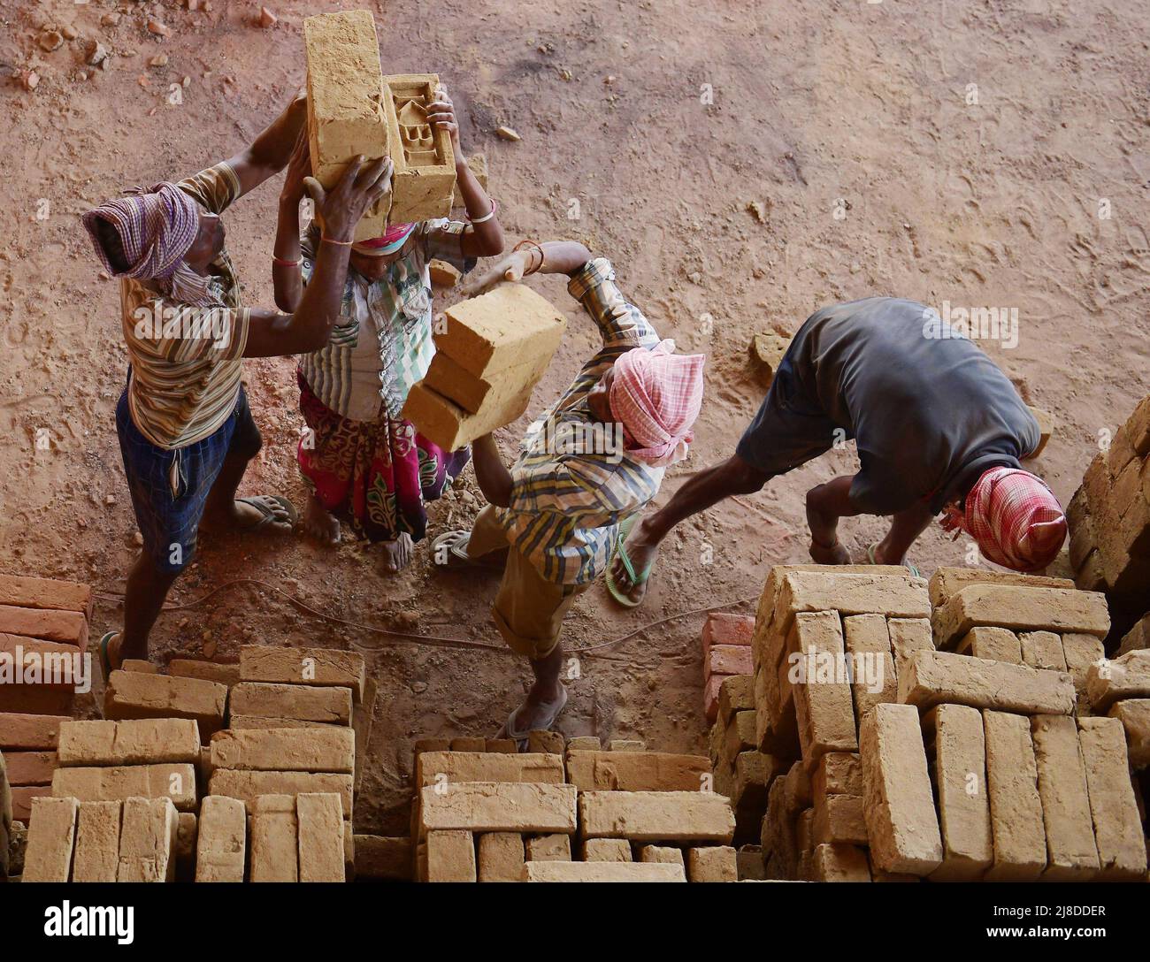 Labourers are working at a brick factory on May Day. May 1st is known ...
