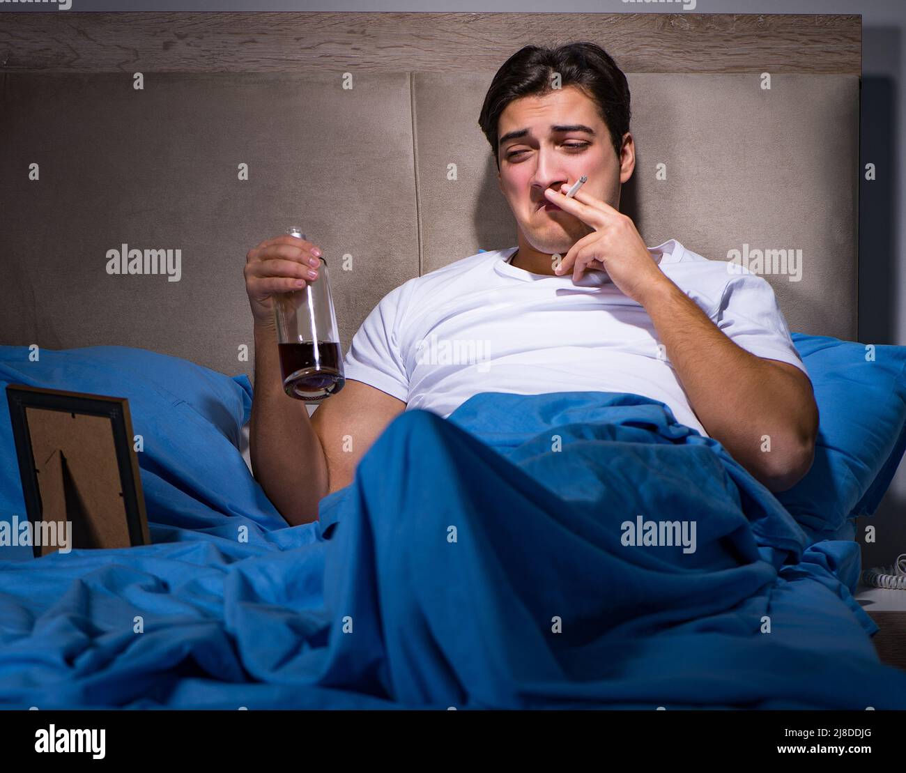 The desperate man divorced in bed Stock Photo - Alamy