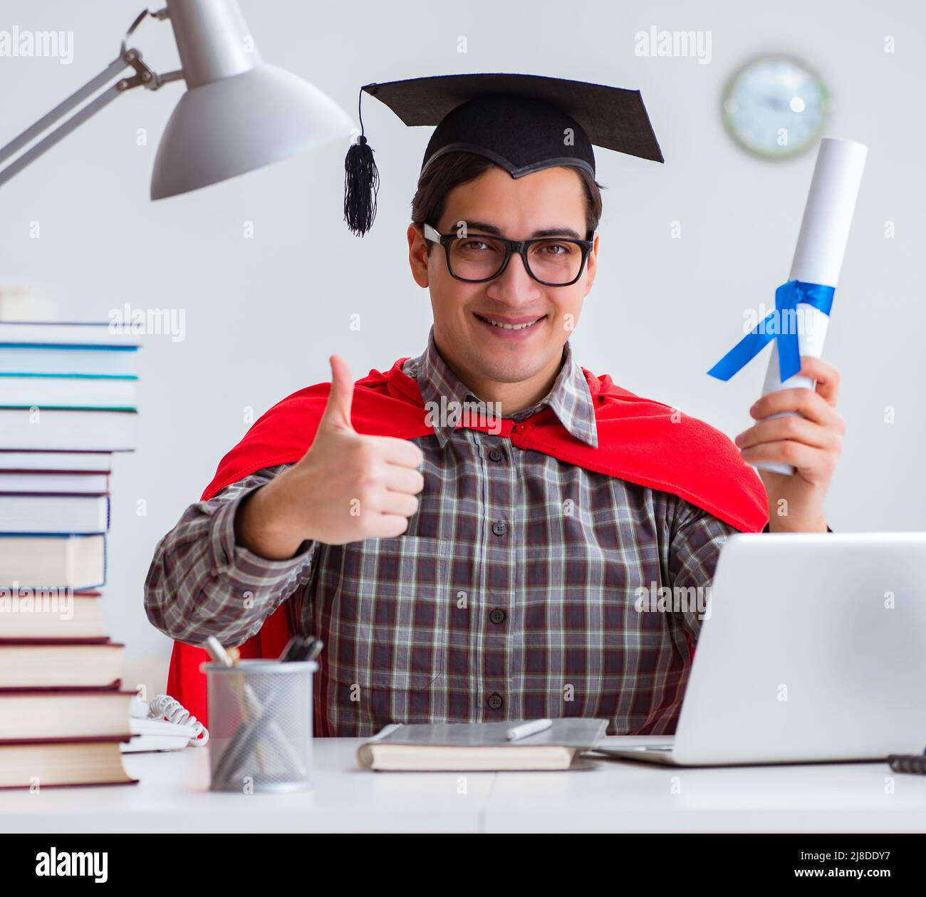 The super hero student with books studying for exams Stock Photo - Alamy