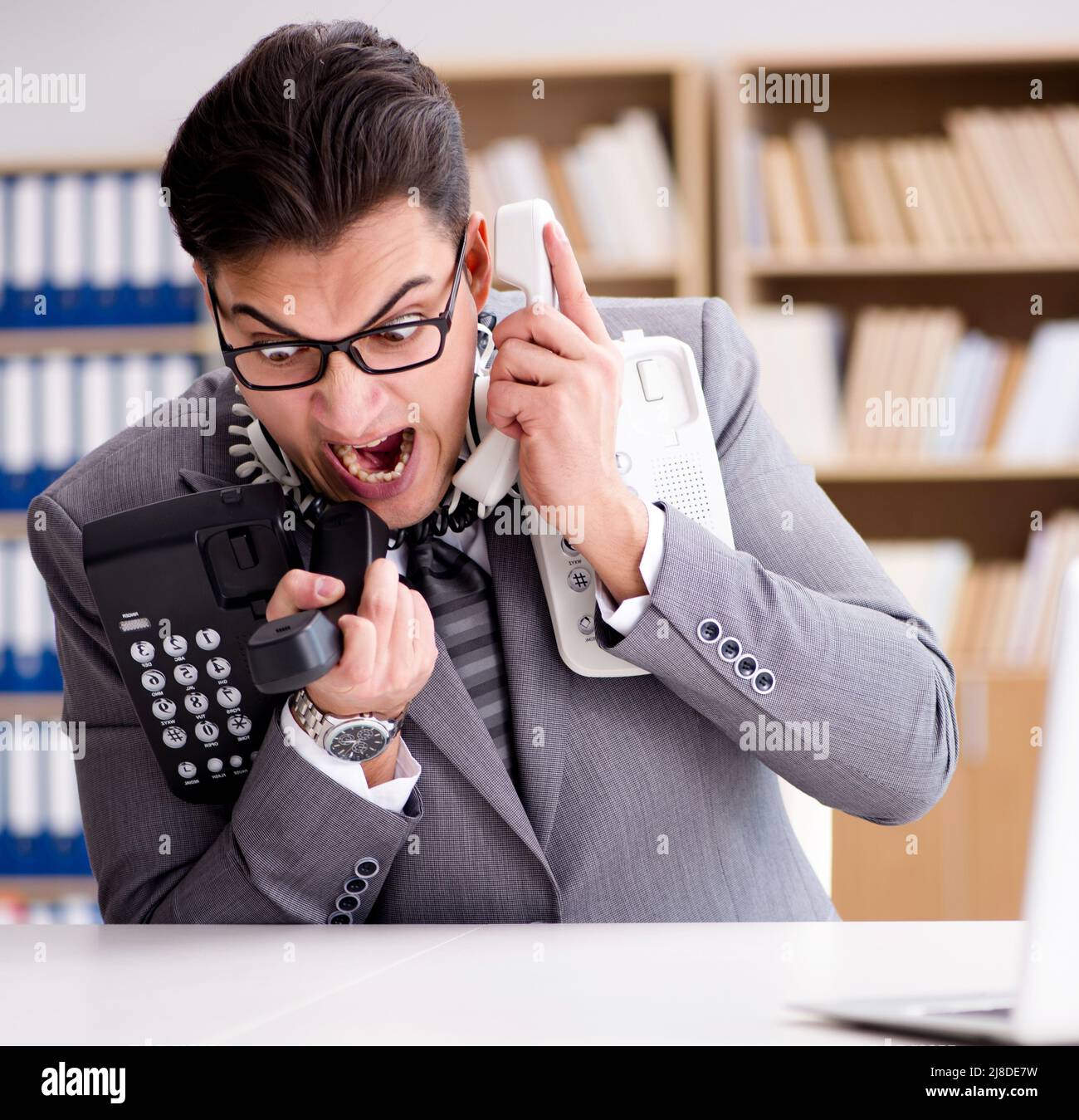 The angry helpdesk operator yelling in office Stock Photo - Alamy