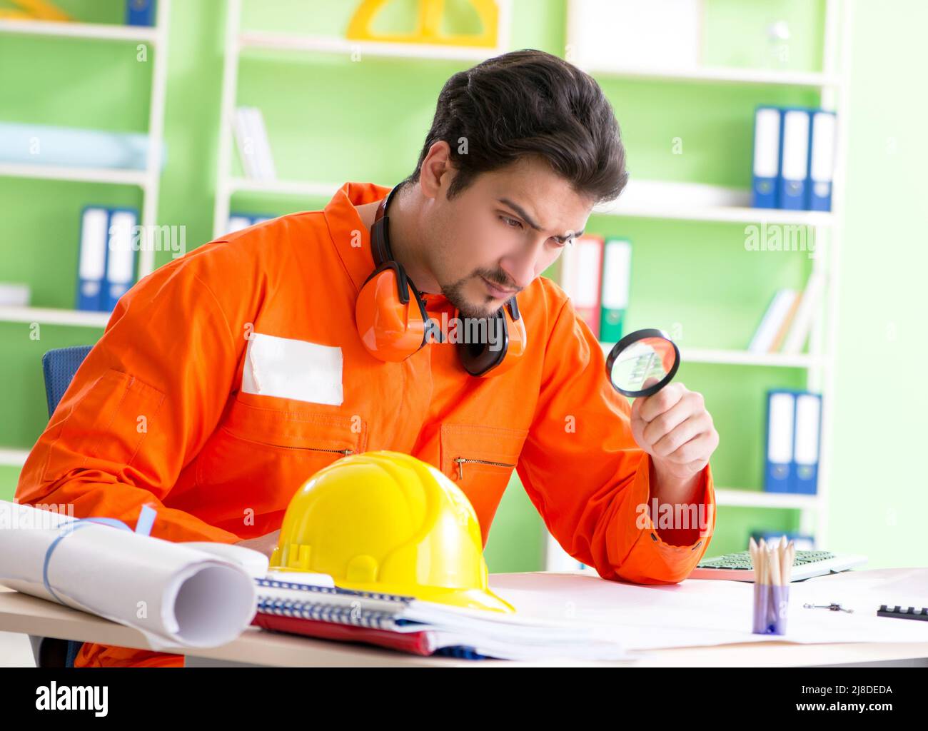 The construction supervisor planning new project in office Stock Photo ...